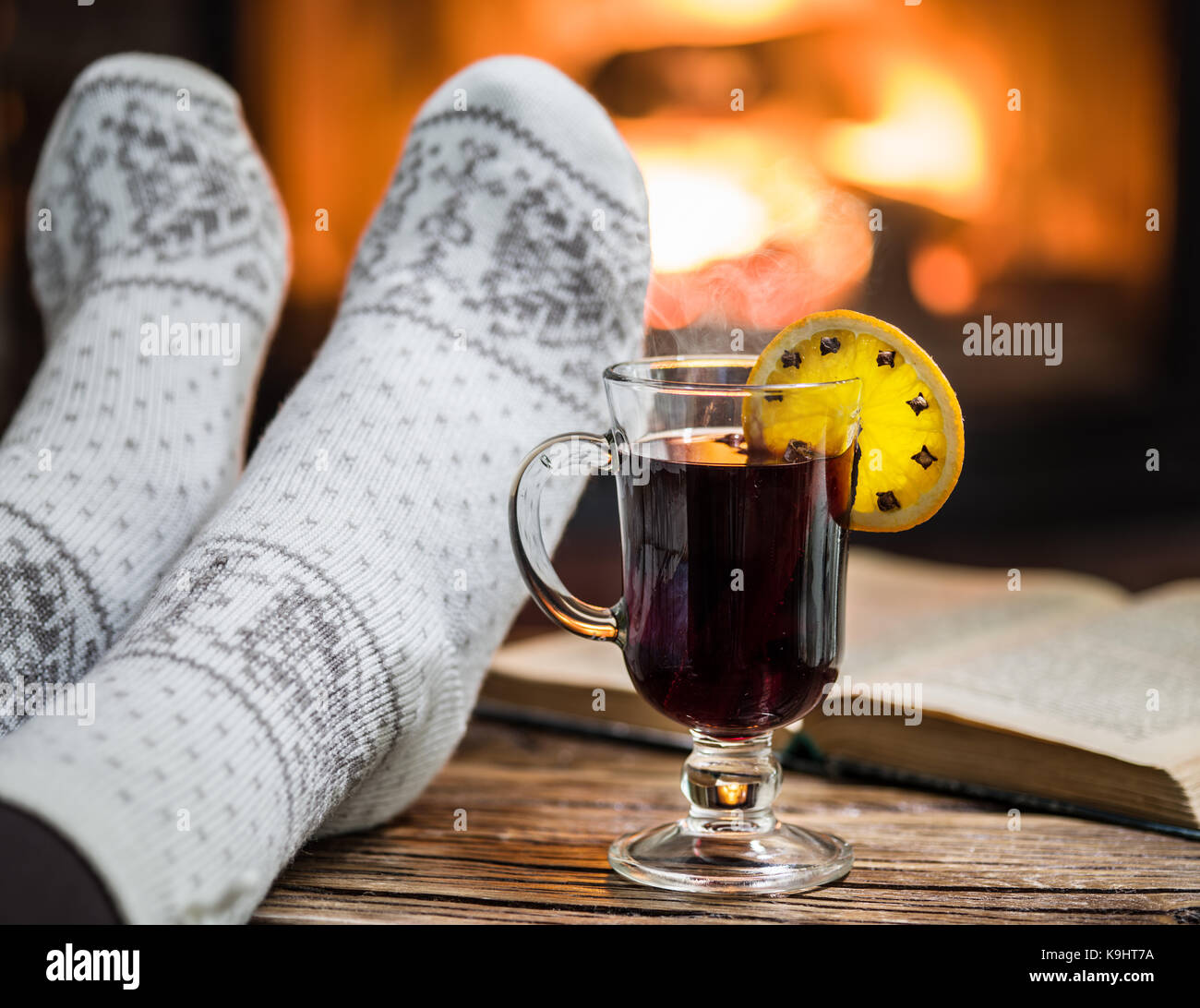 Fire fireplace reading cozy wine hi-res stock photography and images ...