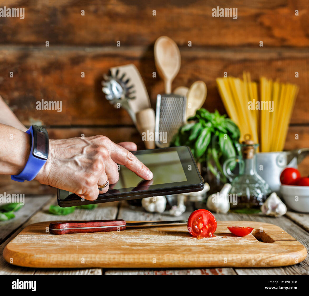 Concept: cooking in the kitchen in the restaurant. The cook is holding ...