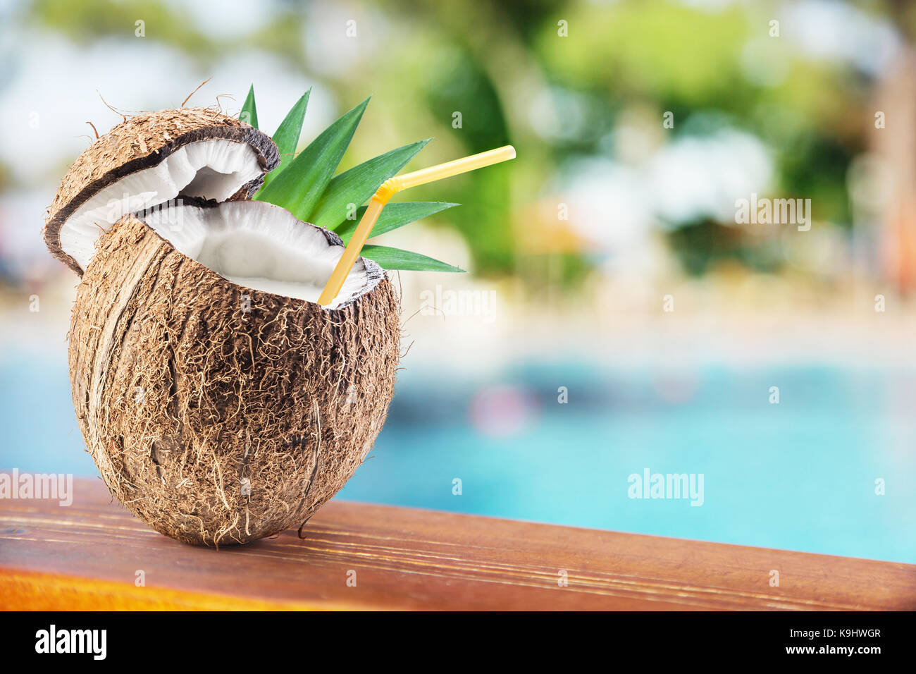 Coconut with cocnut milk on the bar table at the open-air cafe Stock ...