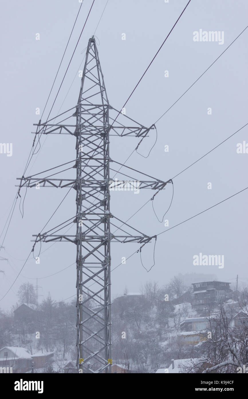 Energy and technology: electrical post by the road with power line ...