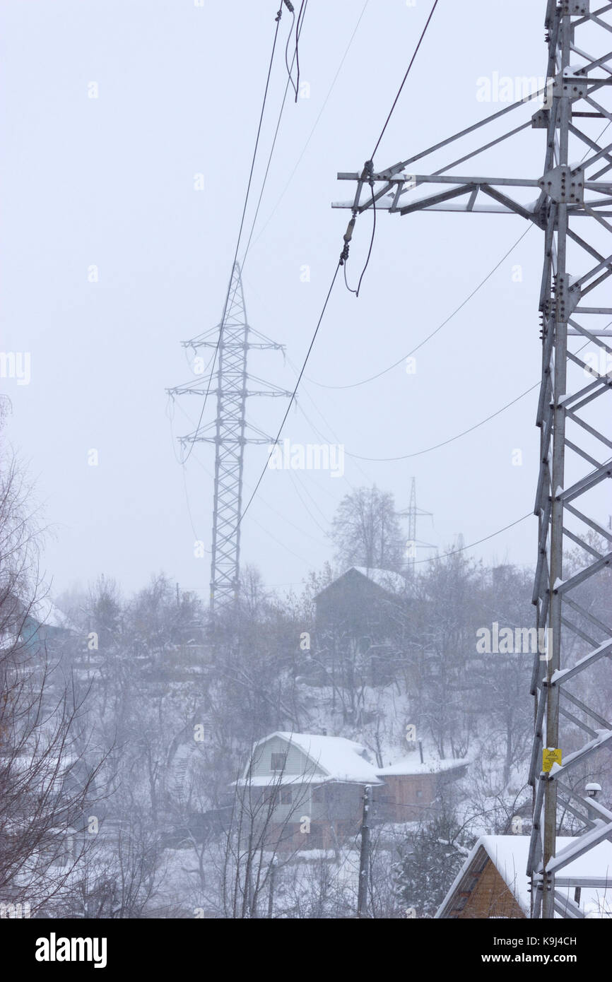 Energy and technology: electrical post by the road with power line ...