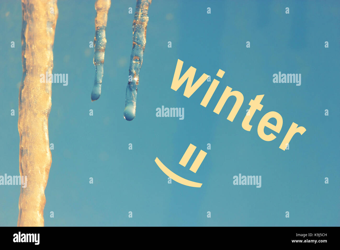 icecle on a background of blue sky. winter concept Stock Photo - Alamy