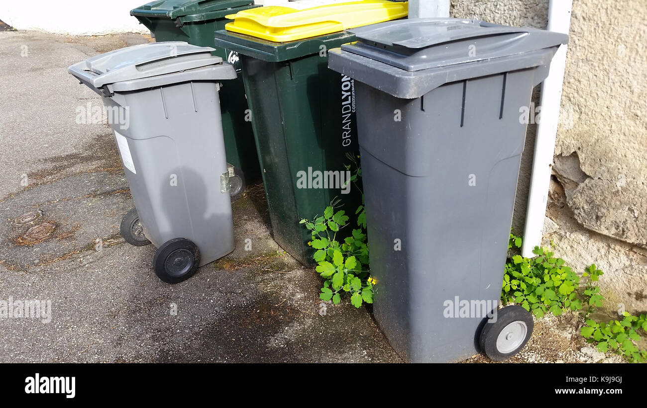 Multiple plastic recycling container bins on street in Lyon, France ...