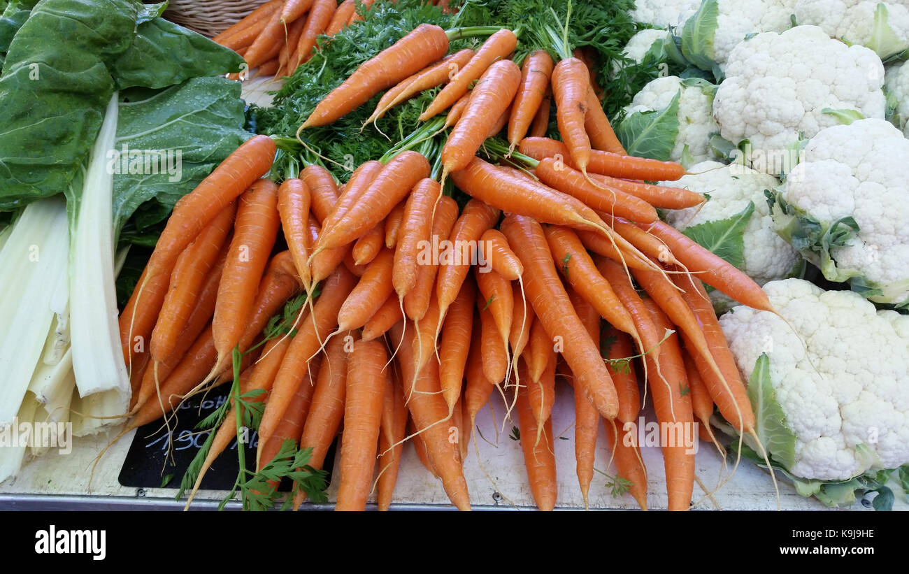 A variety of fresh carrots for sale at a local market. Marché Saint ...