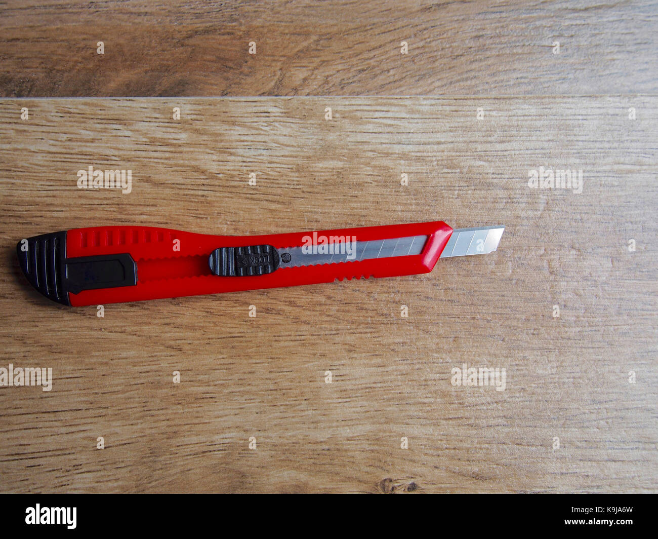 Cutter on wood background Stock Photo - Alamy