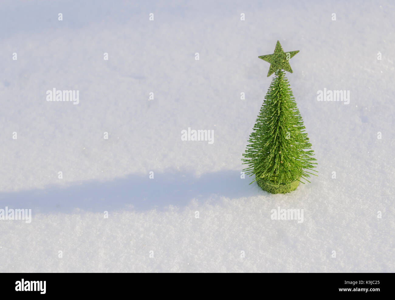 christmas tree on snow Stock Photo - Alamy