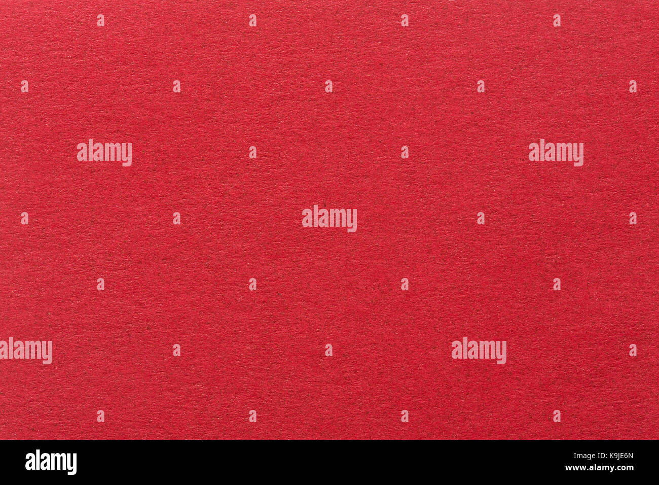 A textured red background with a subtle screen pattern. High quality ...