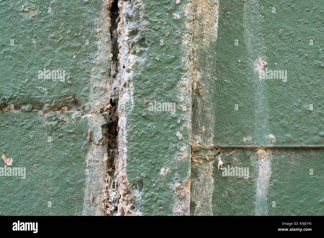 Concrete wall pillar in bad condition showing cracks and signs of ...