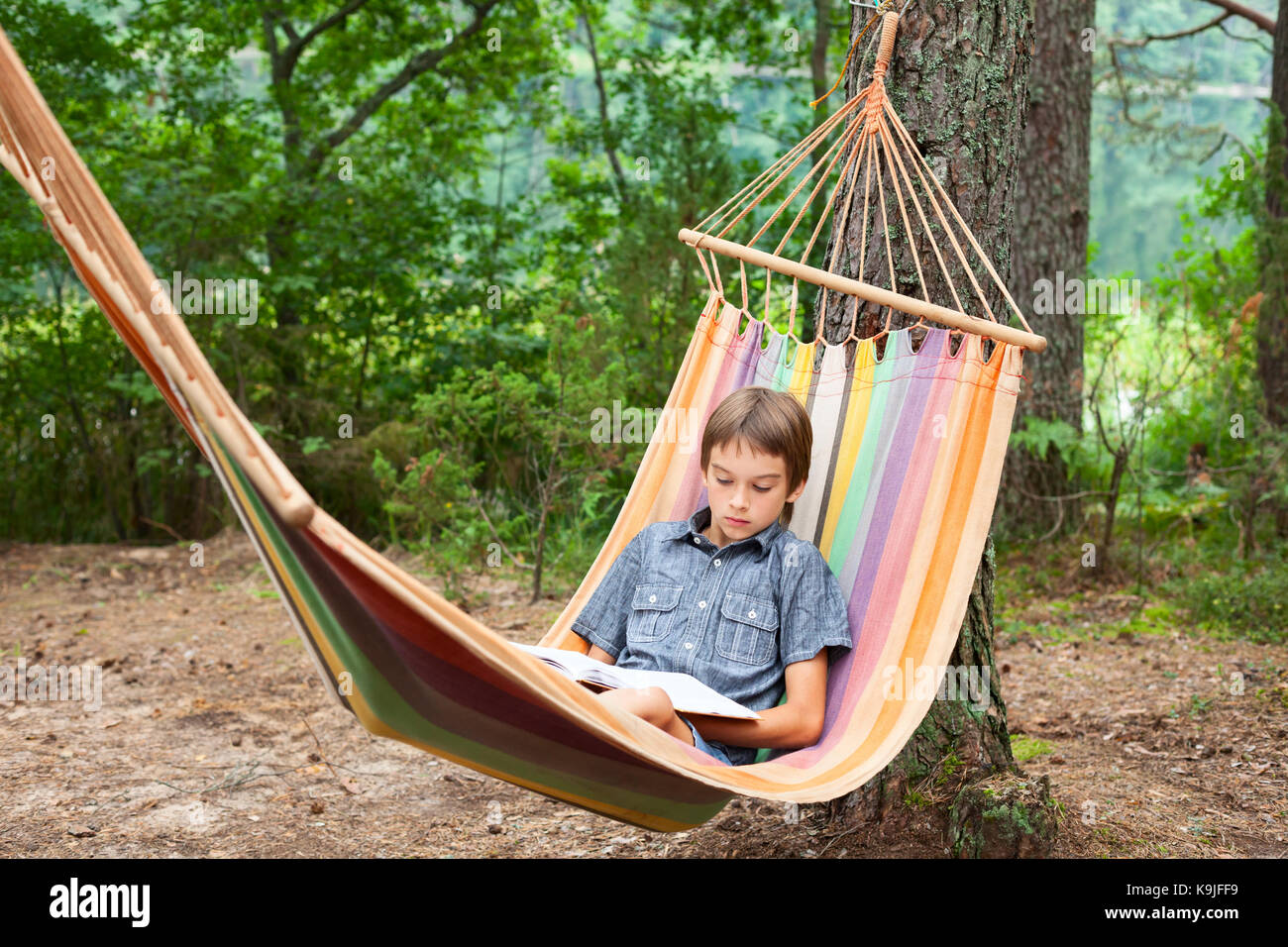 Boy in a hammock hi-res stock photography and images - Alamy