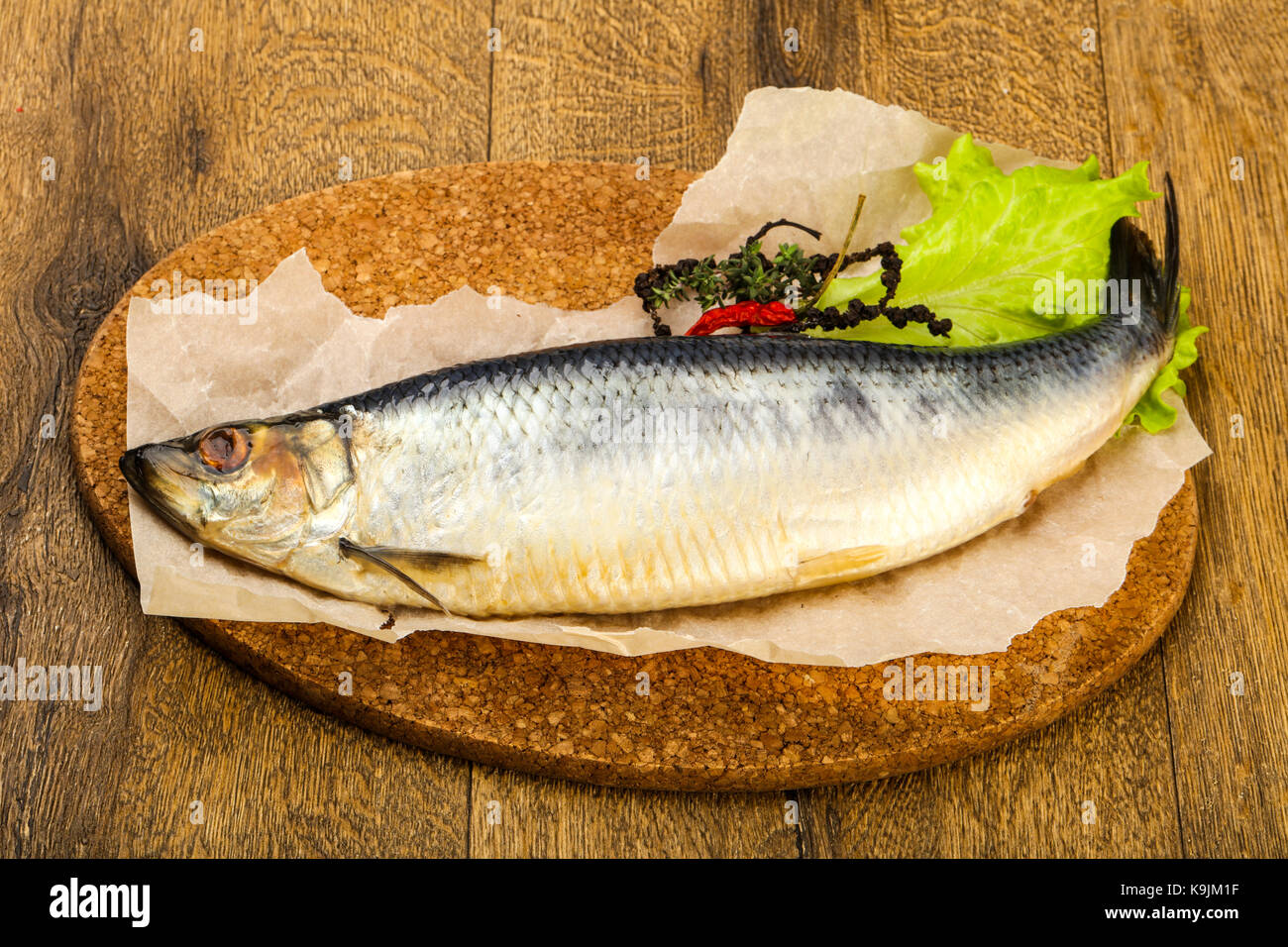 Salted Herring fish with pepper and spices Stock Photo - Alamy