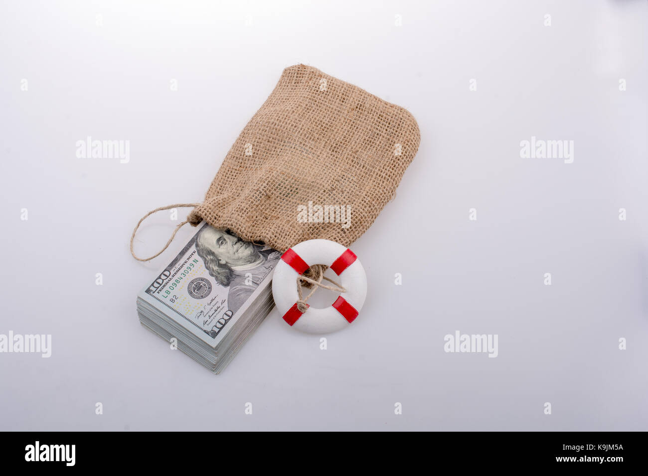 Life preserver placed on the banknote bundle of US dollar Stock Photo ...
