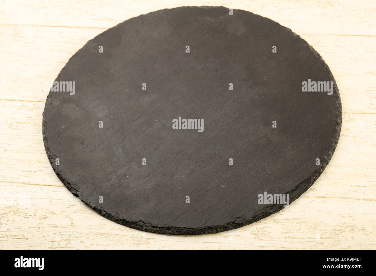Black stone plate for home and restorant use Stock Photo - Alamy