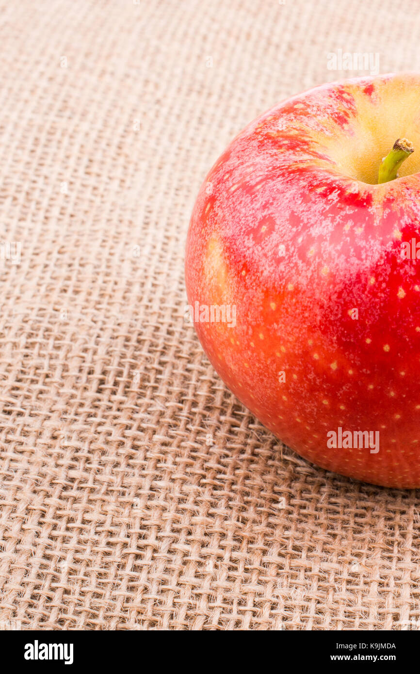 Fresh red apple placed on a canvas Stock Photo - Alamy