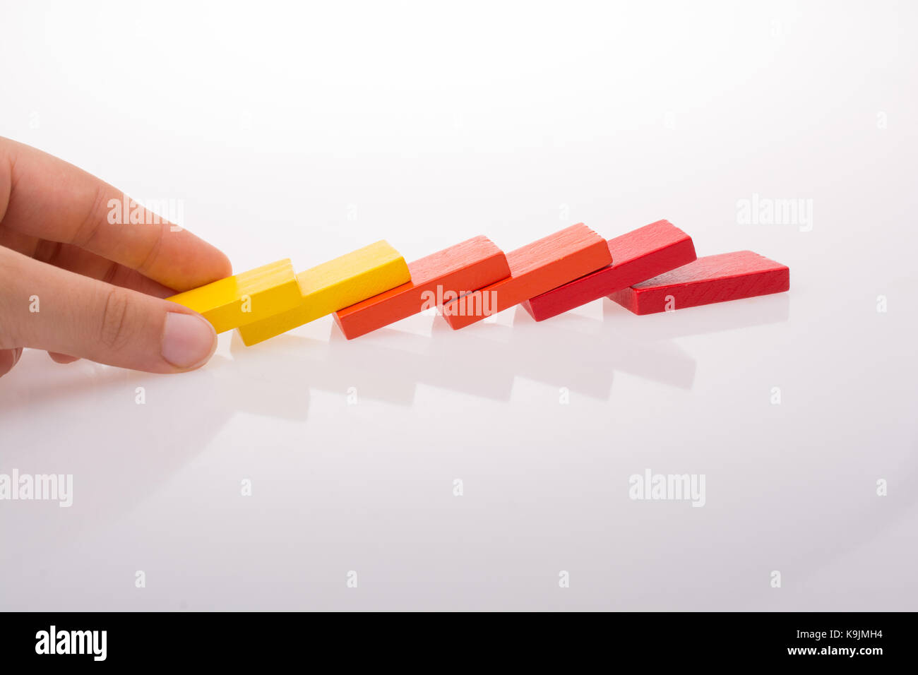Colorful Domino Blocks in a line on a white background Stock Photo - Alamy