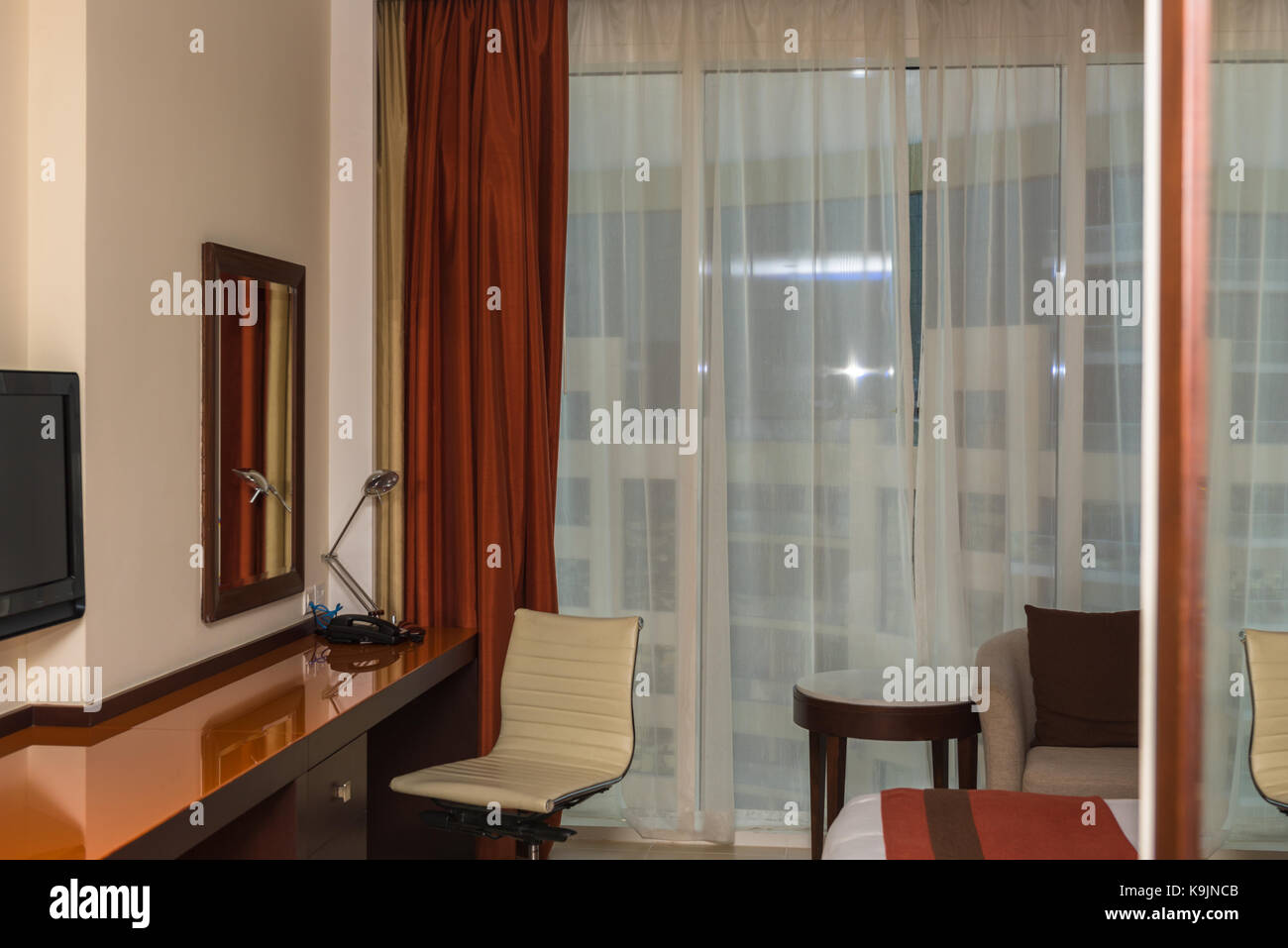 Hotel room with a window and curtains Stock Photo - Alamy