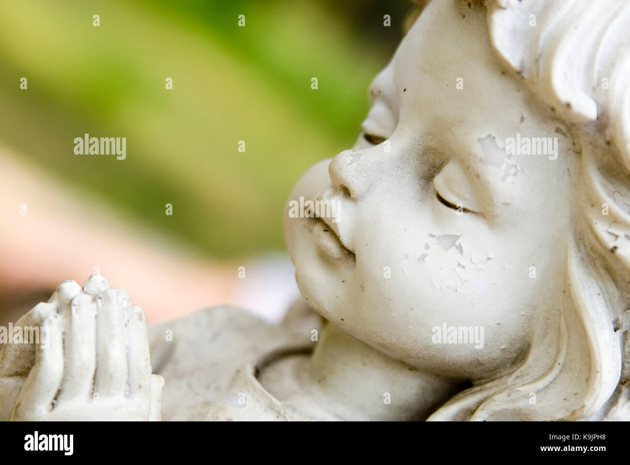 fragment shapes little angel in a city park Stock Photo - Alamy