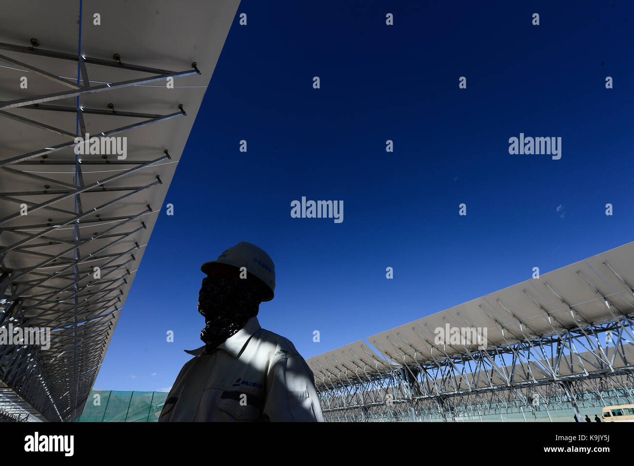 Delingha, China's Qinghai Province. 23rd Sep, 2017. A worker walks past ...