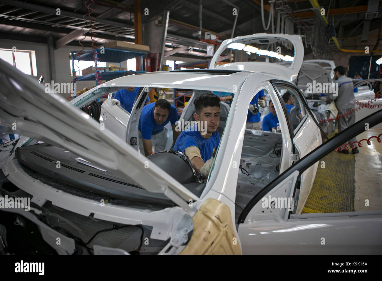 Tehran, Iran. 23rd Sep, 2017. Iranian employees work on a Brilliance ...