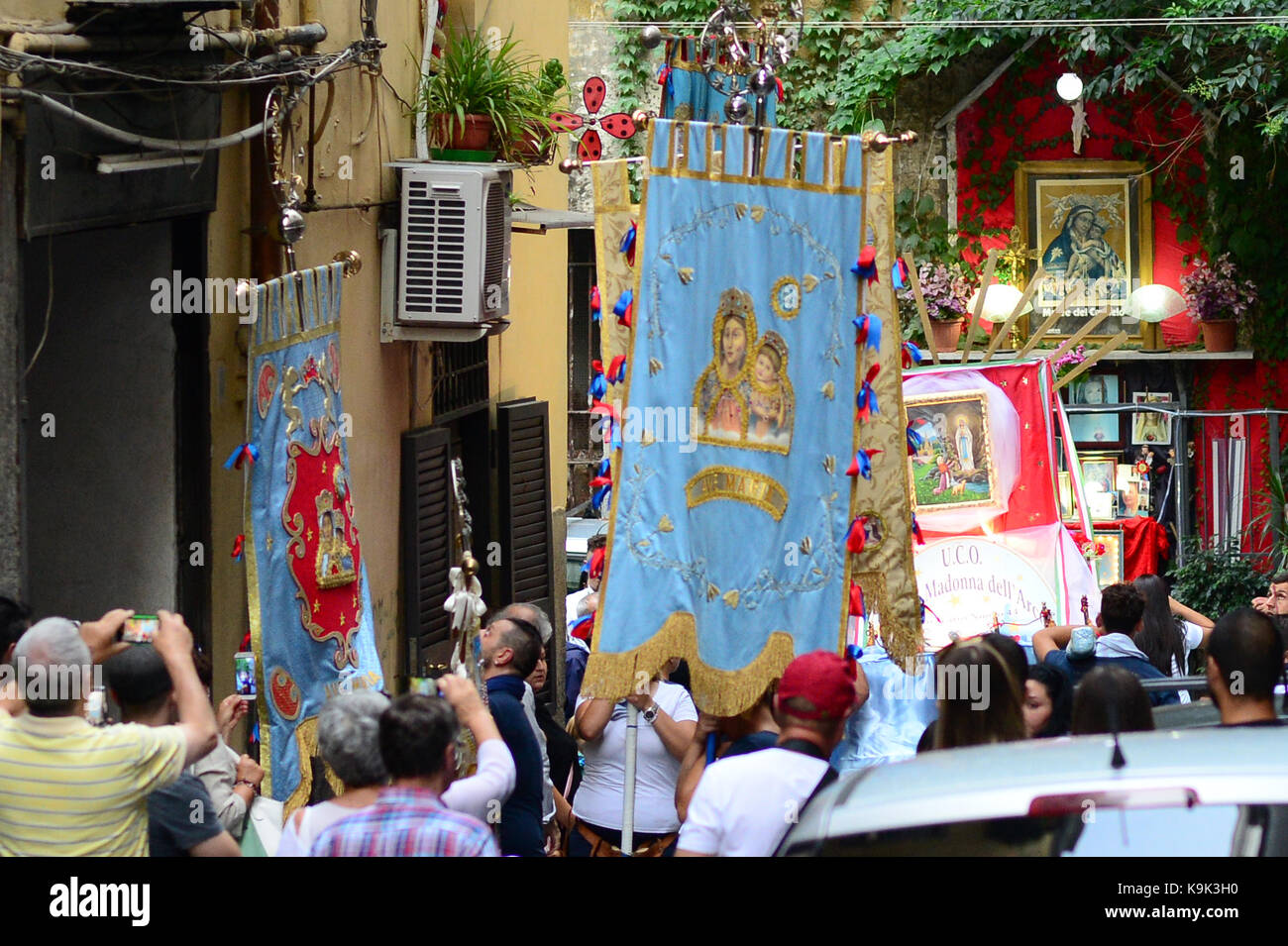 A procession bearing inages of Mary, the mother of Jesus, makes its way ...
