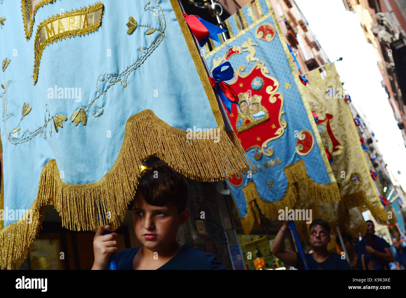 A procession bearing inages of Mary, the mother of Jesus, makes its way ...