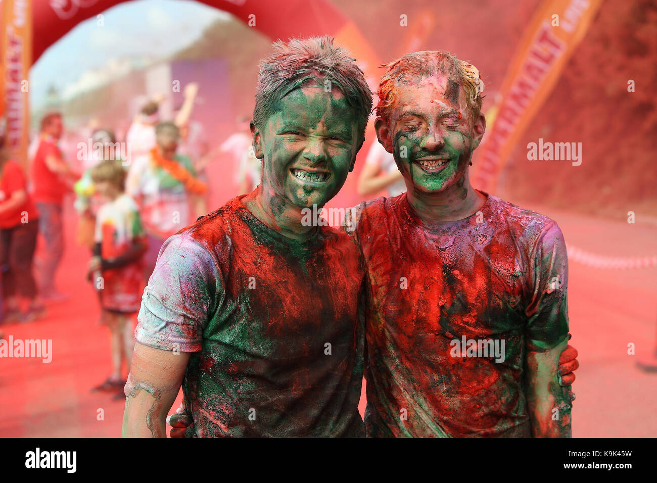Colourful young runners at the Brighton 5K Color Run, Madeira Drive ...