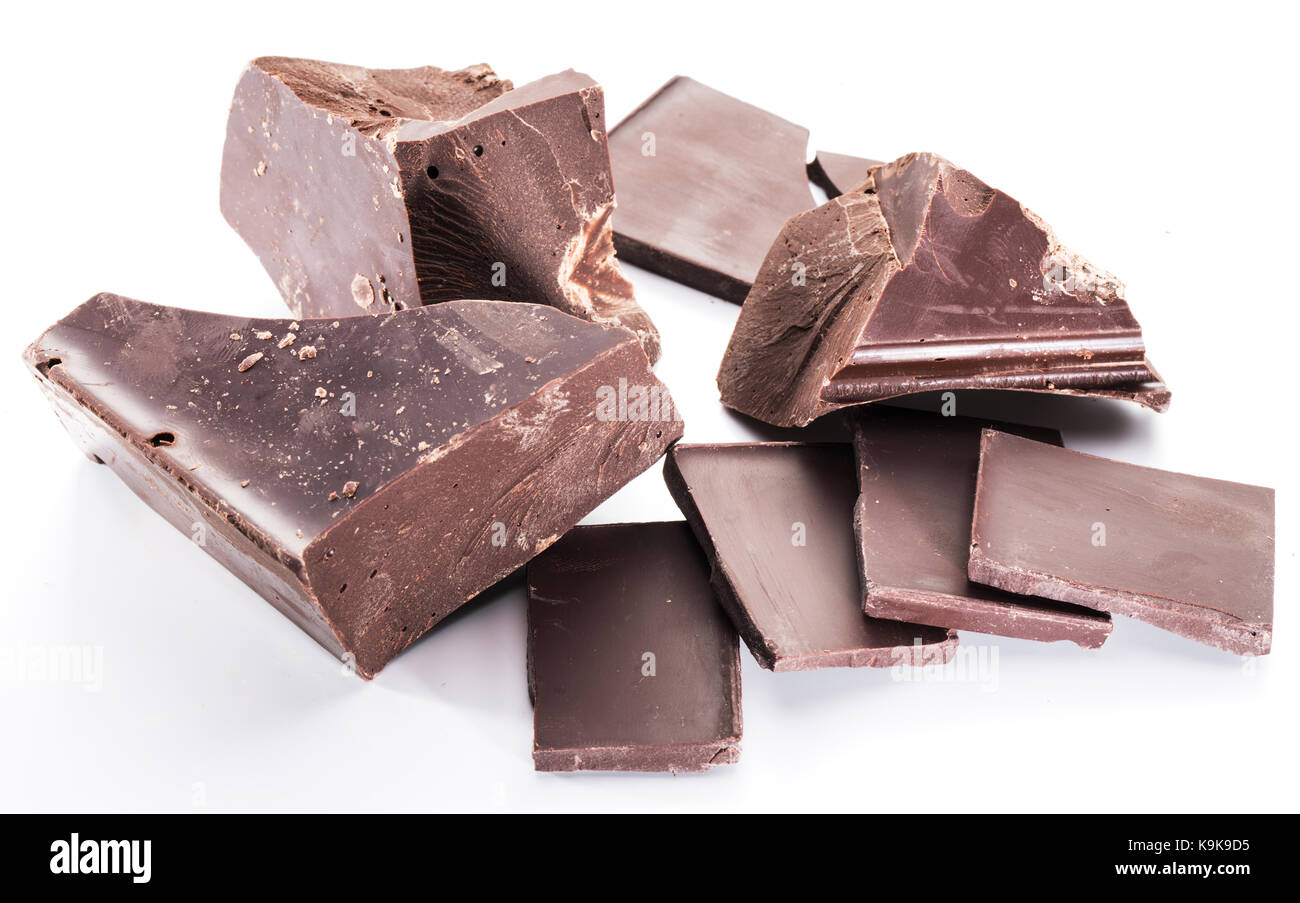 Chocolate blocks and pieces of chocolate bar isolated on a white ...