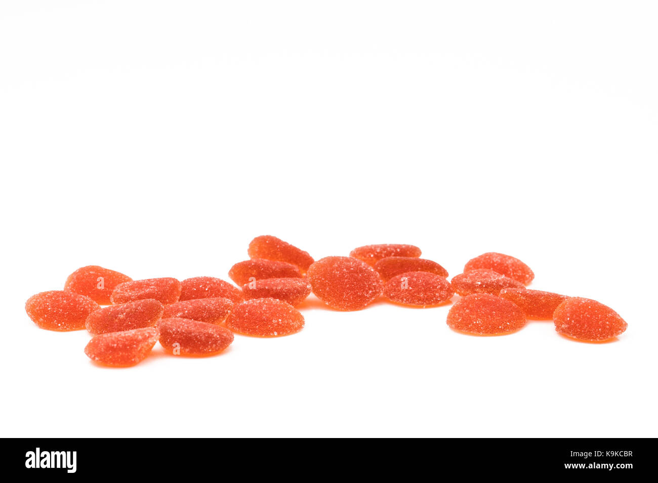 Pile of orange flavored vitamin pastille with clipping path ...