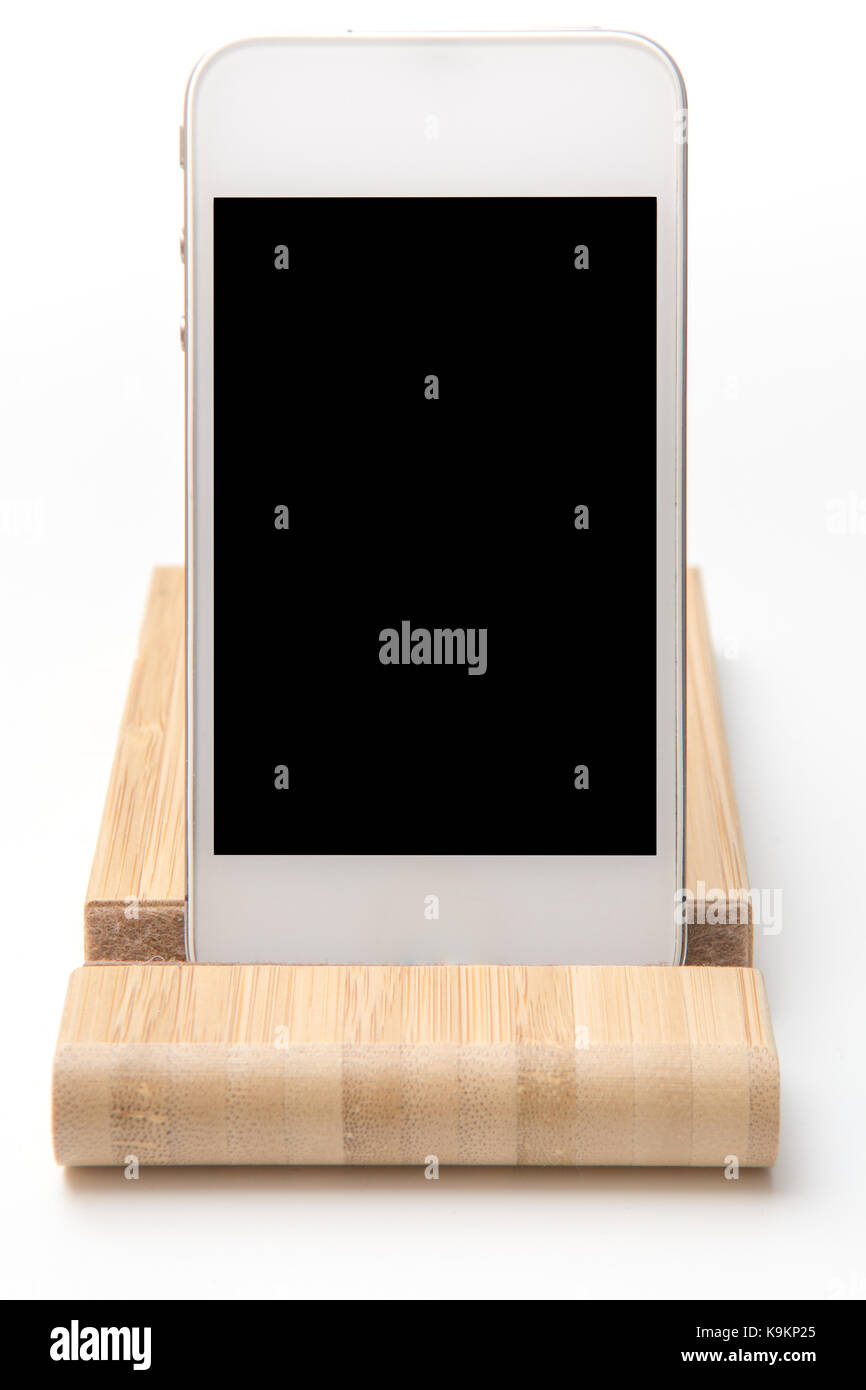 smart phone and tablet wireless charging on a white desk Stock Photo ...