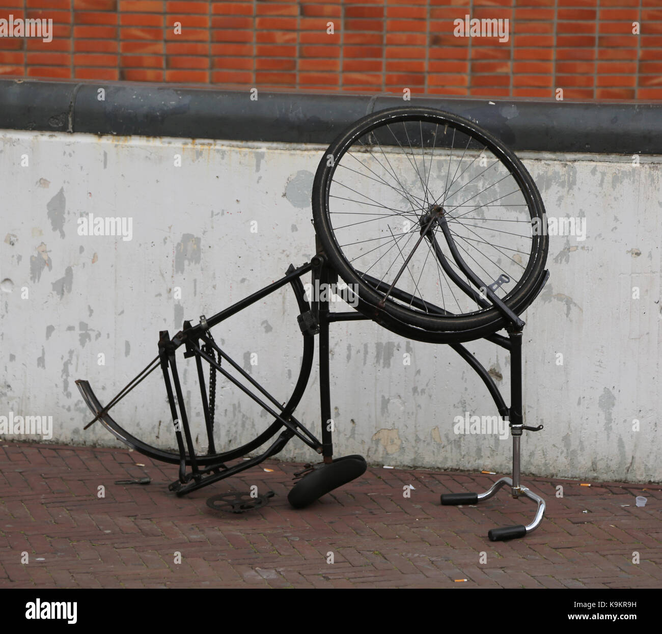 overturned bike ride and with a wheel stolen by thieves in the city ...