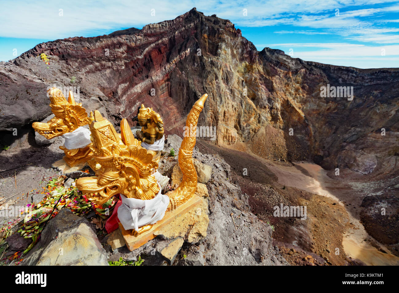 Balinese shrine on brink of volcanic crater with traditional offering ...