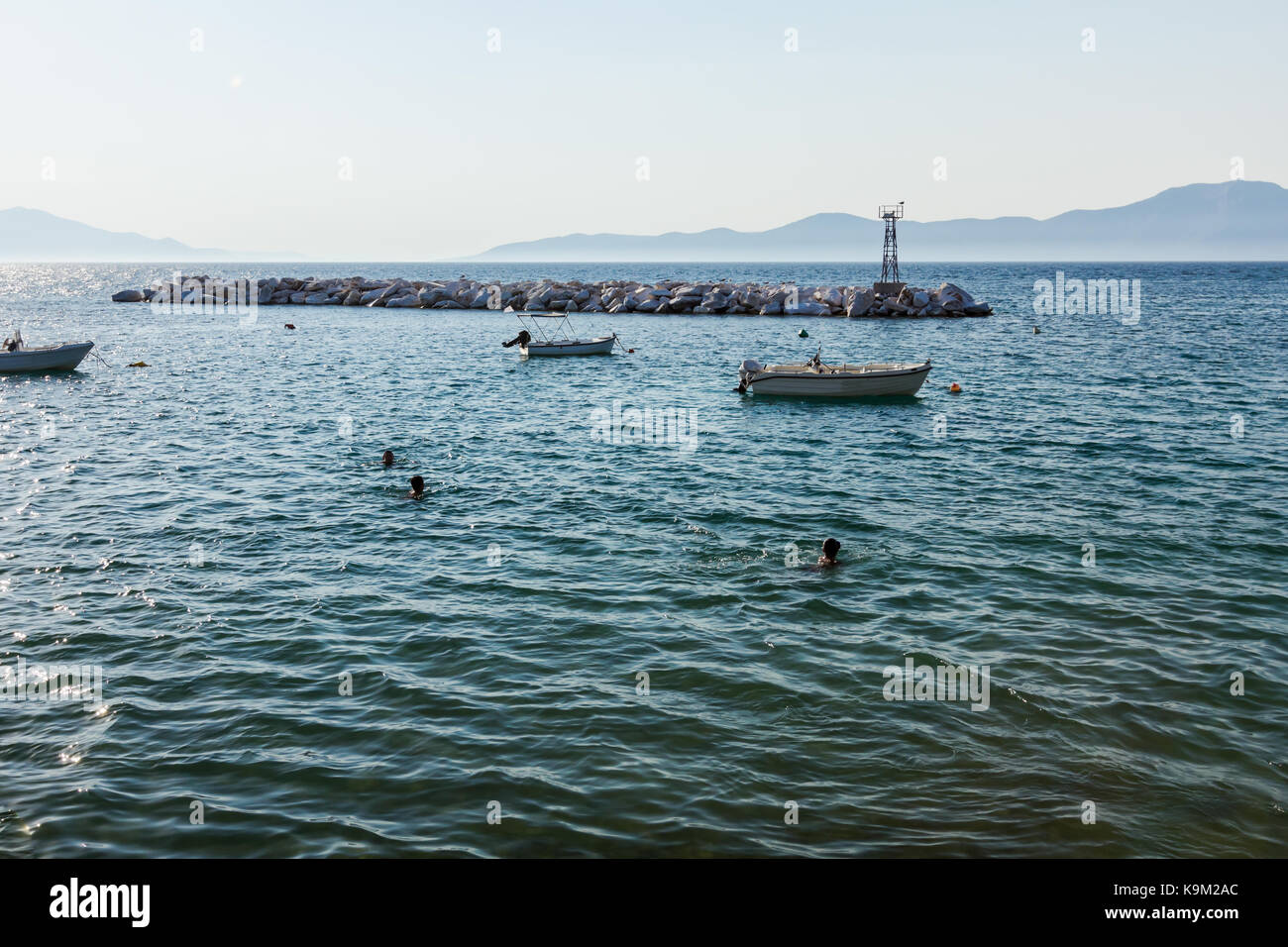Break wall protects harbor with ships and boats from the waves in ...