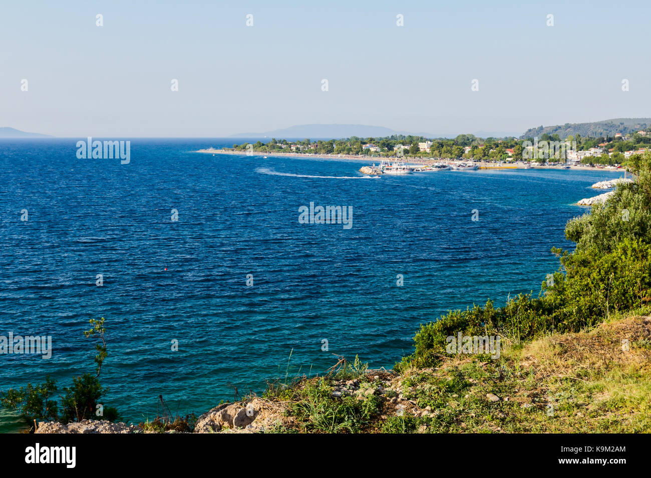 Landscape of beautiful settlement in calm bay, coast Stock Photo - Alamy