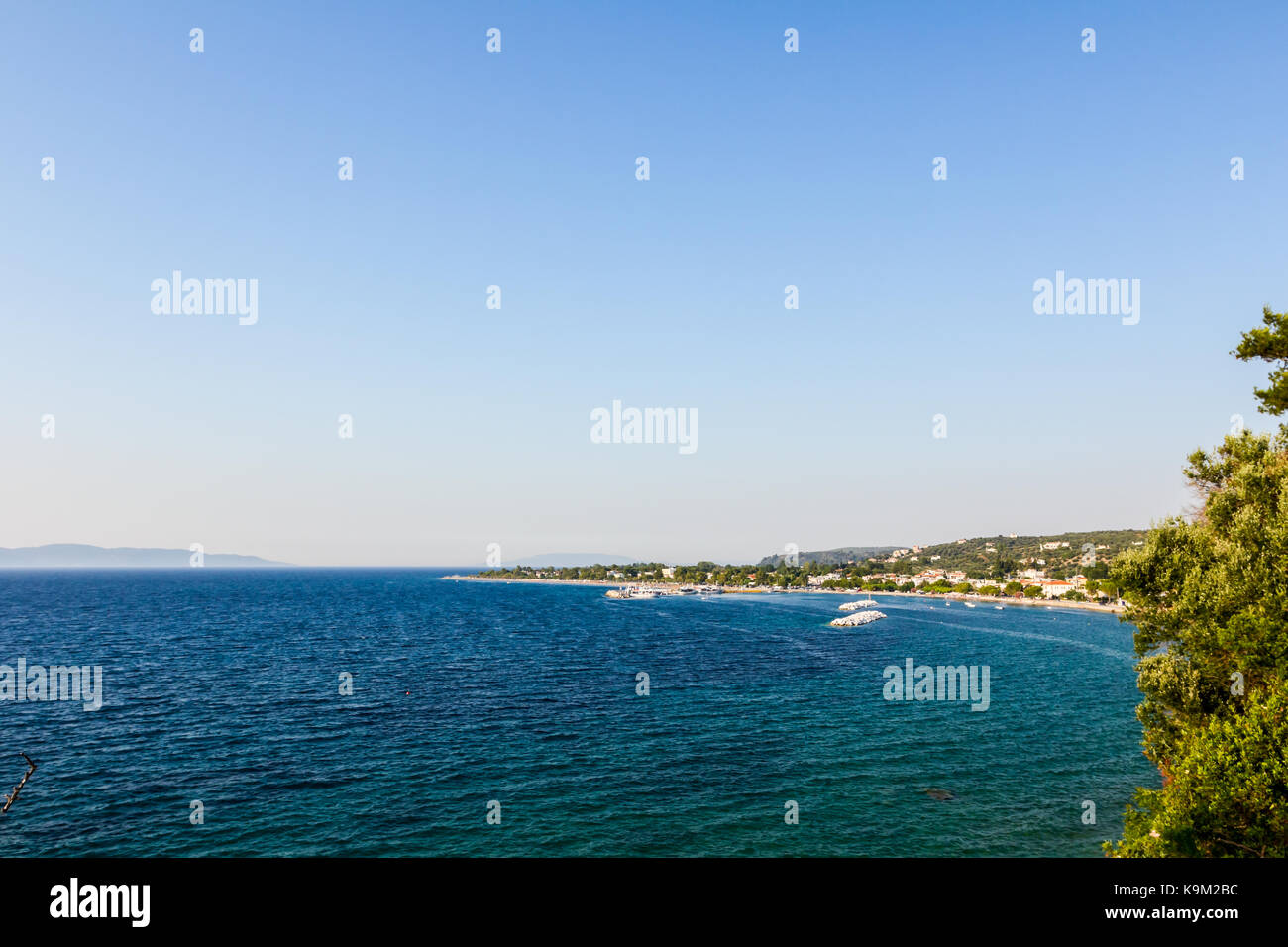Landscape of beautiful settlement in calm bay, coast Stock Photo - Alamy