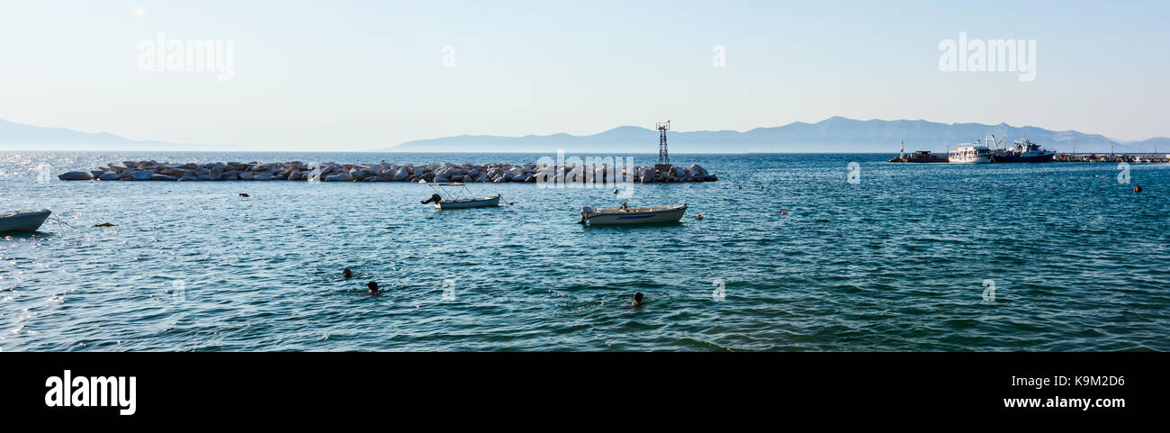 Panorama showing break wall for protection harbor with ships and boats ...