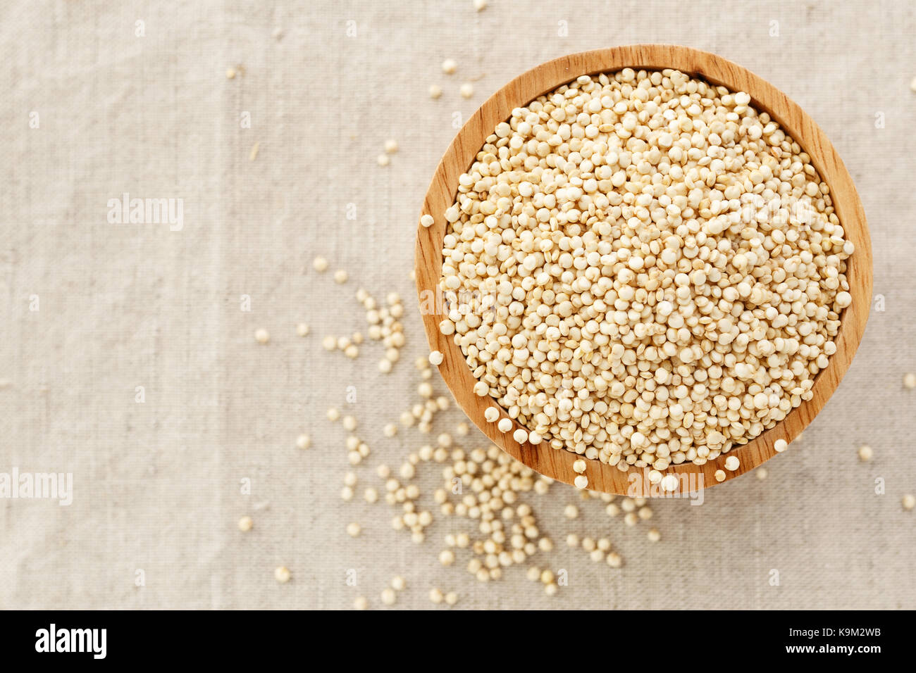 Quinoa in bowl from top view background with space Stock Photo - Alamy