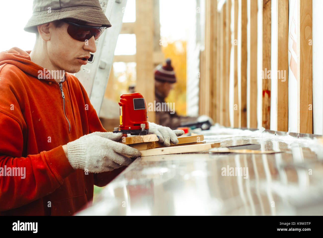 Use of the measuring tool for level installation Stock Photo - Alamy