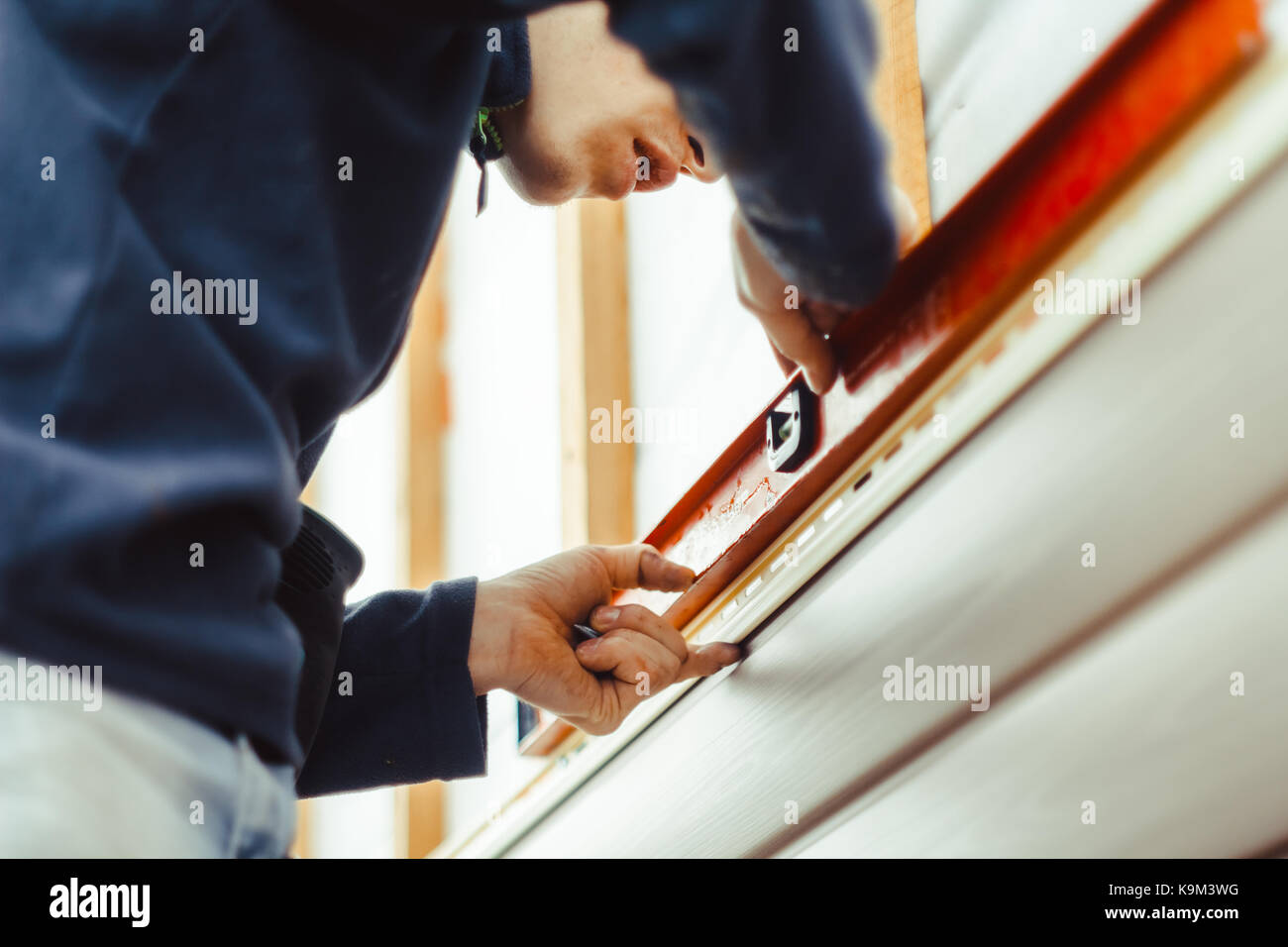 Use of the measuring tool for level installation Stock Photo - Alamy