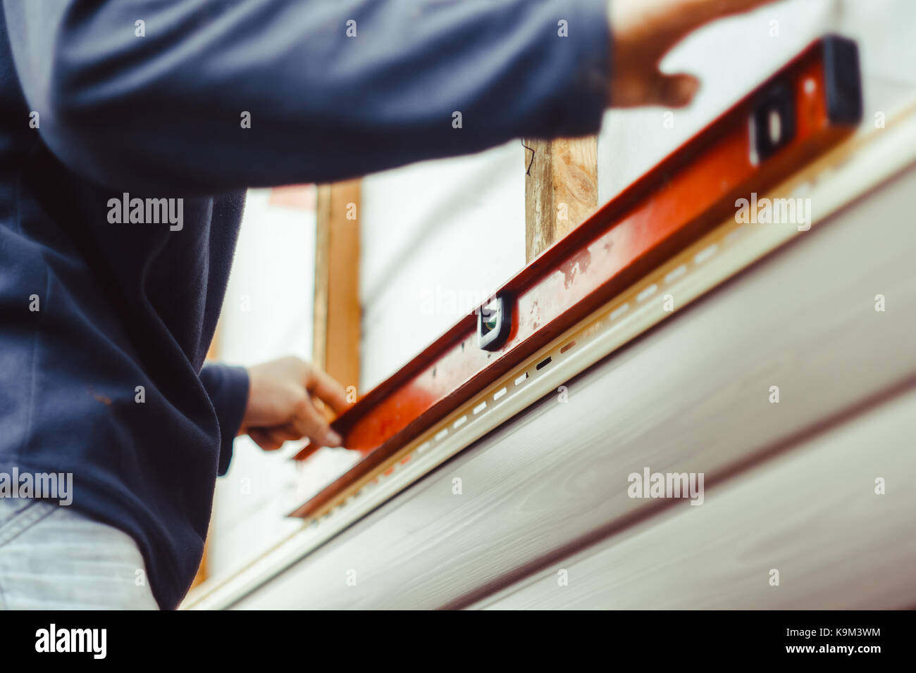 Use of the measuring tool for level installation Stock Photo - Alamy