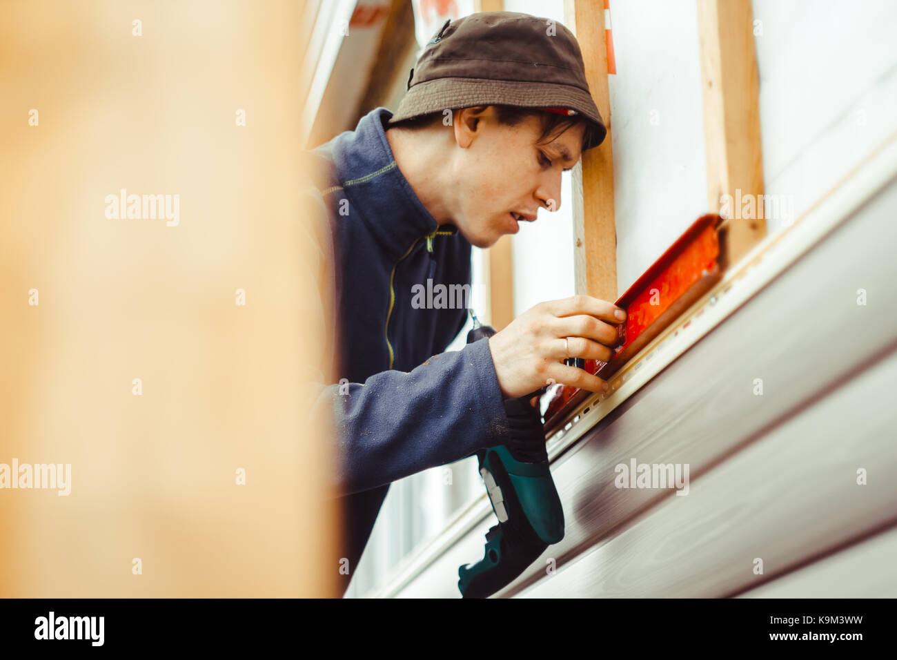 Use of the measuring tool for level installation Stock Photo - Alamy