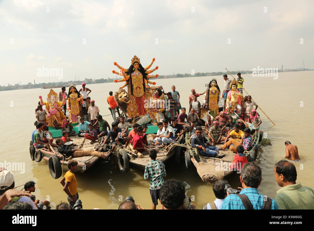 A clay statue of the Indian Hindu goddess Durga is transported from a ...