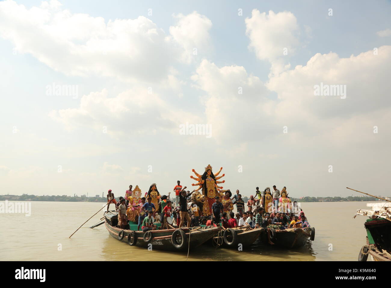 A clay statue of the Indian Hindu goddess Durga is transported from a ...