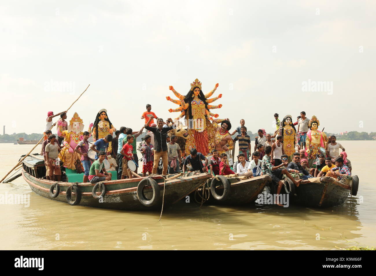 A clay statue of the Indian Hindu goddess Durga is transported from a ...