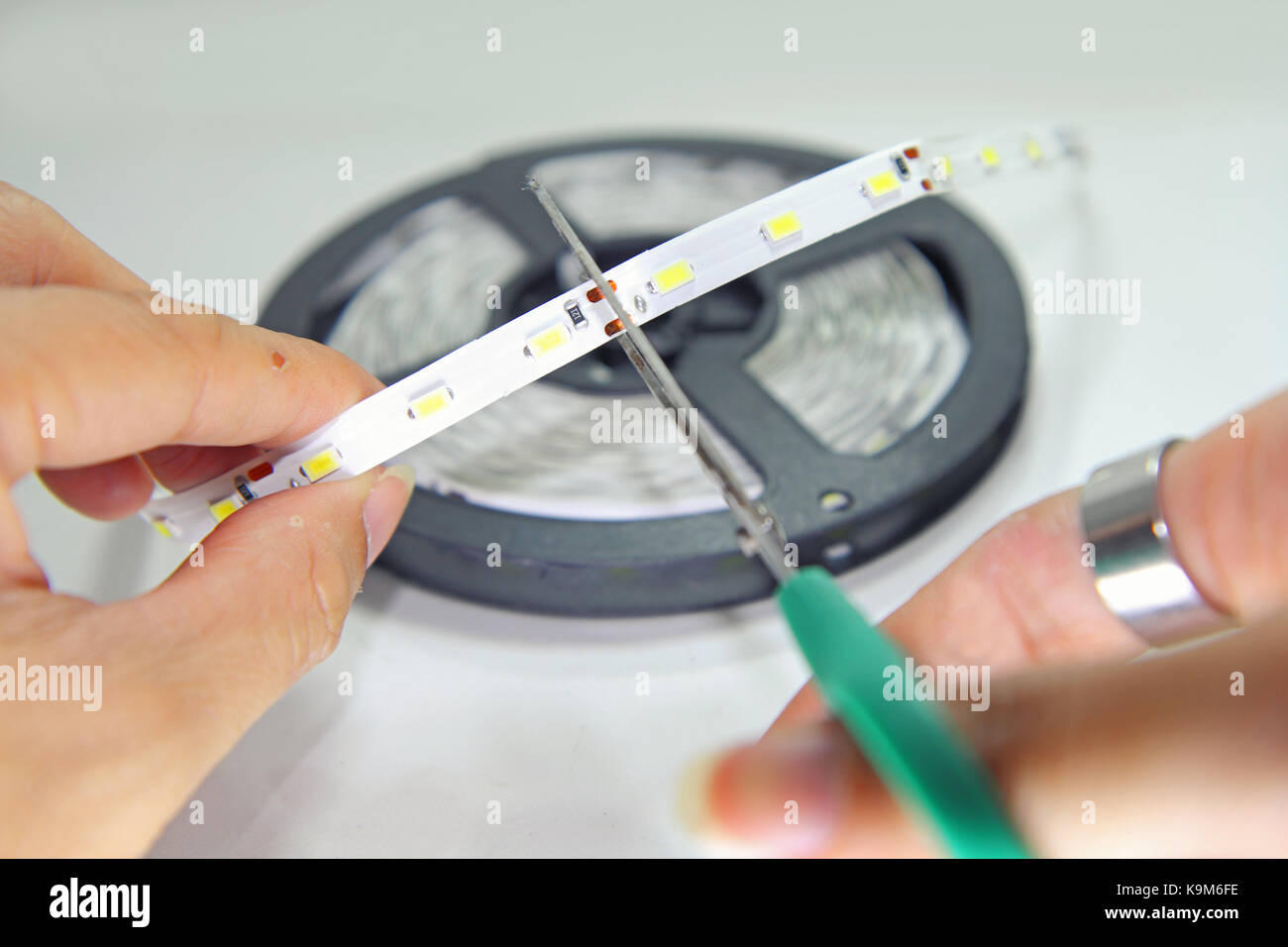 Cut the led strip by scissors Stock Photo - Alamy
