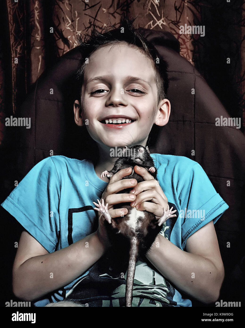 little cheerful boy with rat in your hands Stock Photo - Alamy