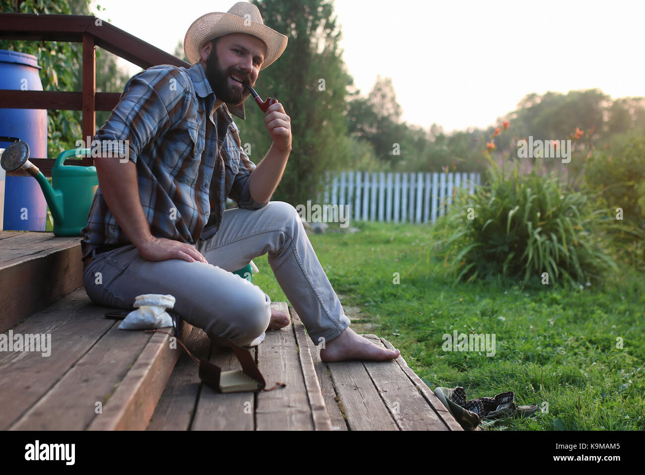 man smoke pipe outdoor Stock Photo - Alamy