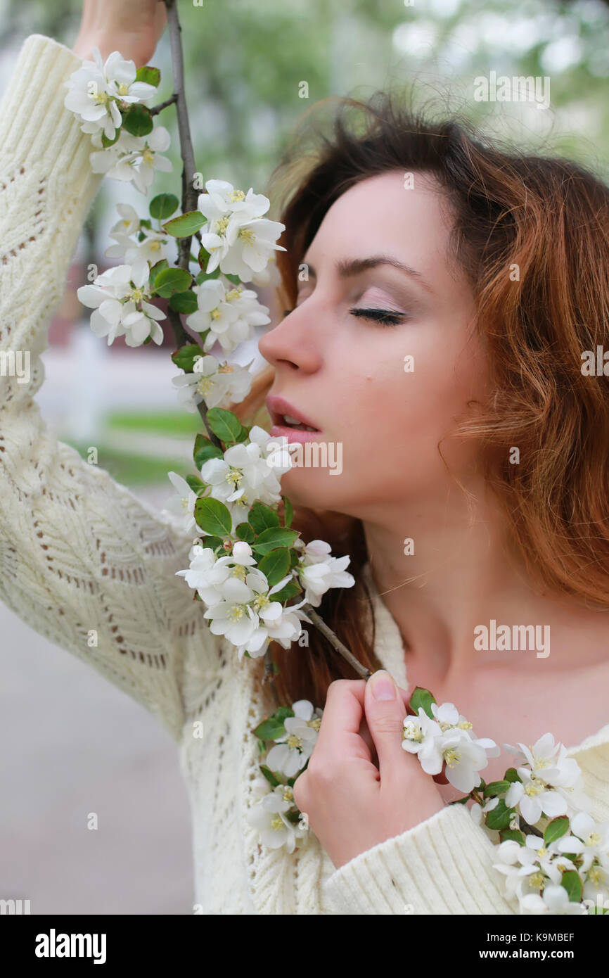woman smell tree flower Stock Photo - Alamy
