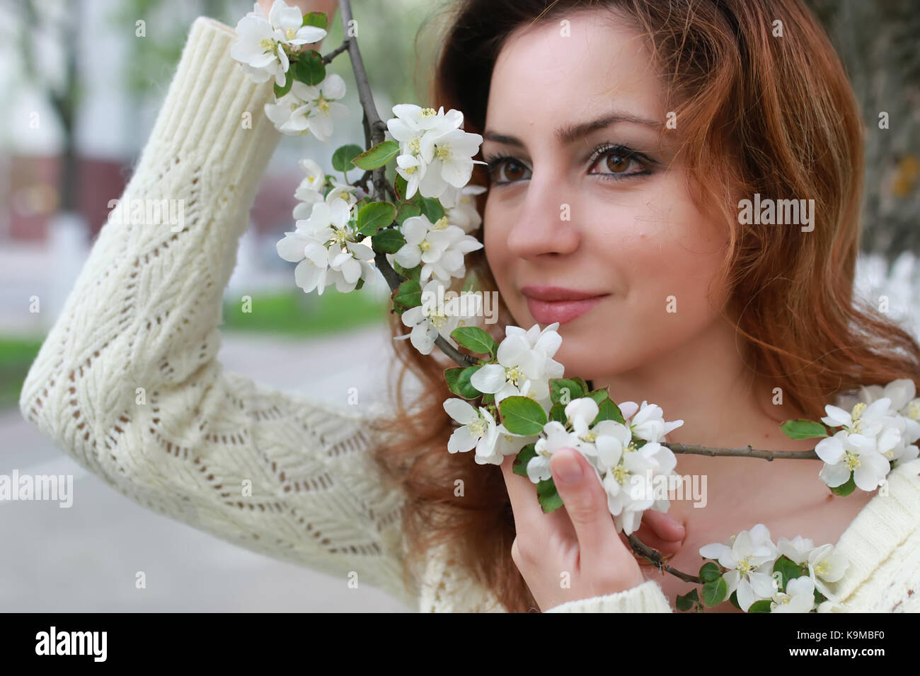 woman smell tree flower Stock Photo - Alamy