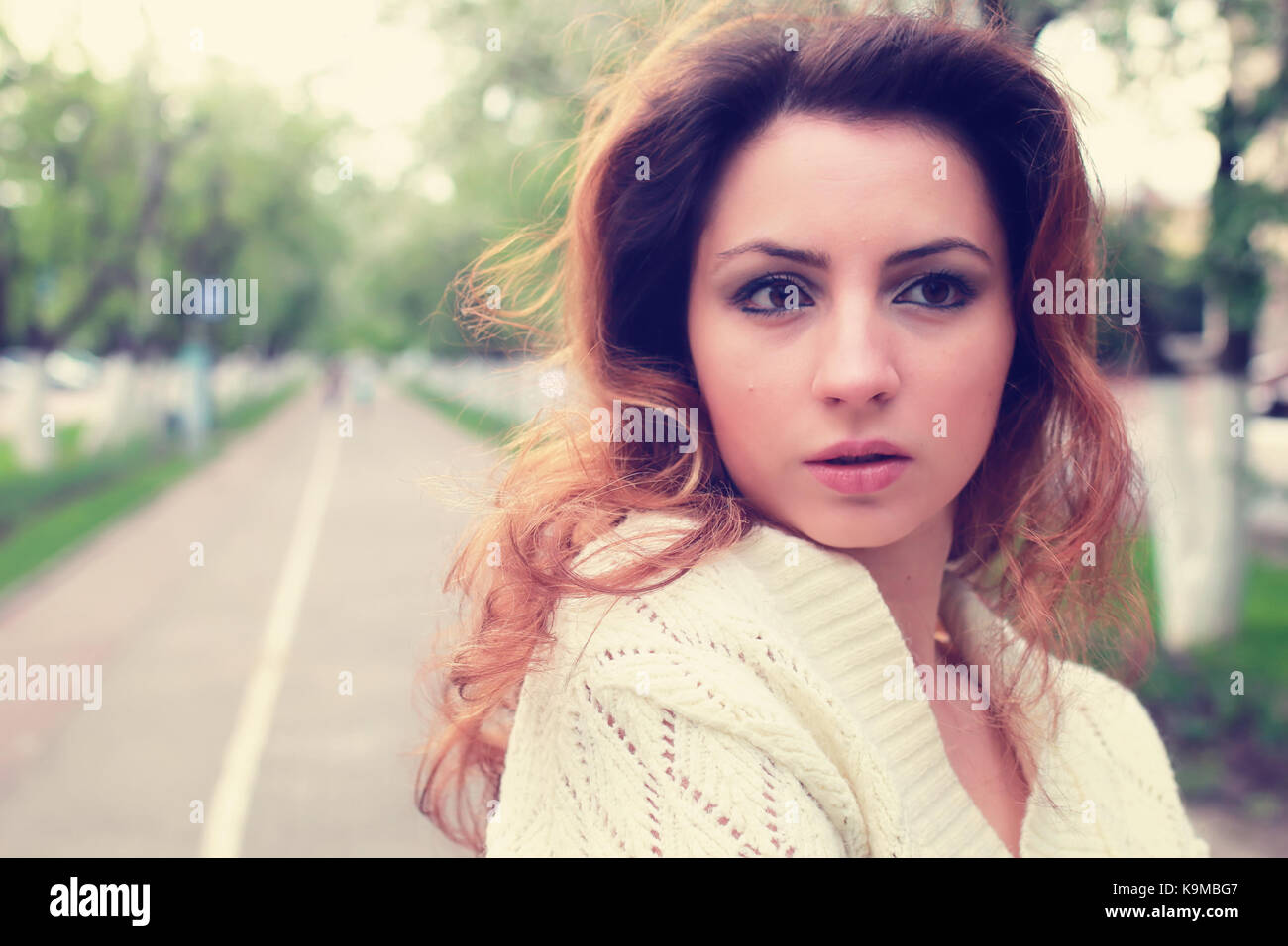 girl walking in spring apple alley Stock Photo - Alamy