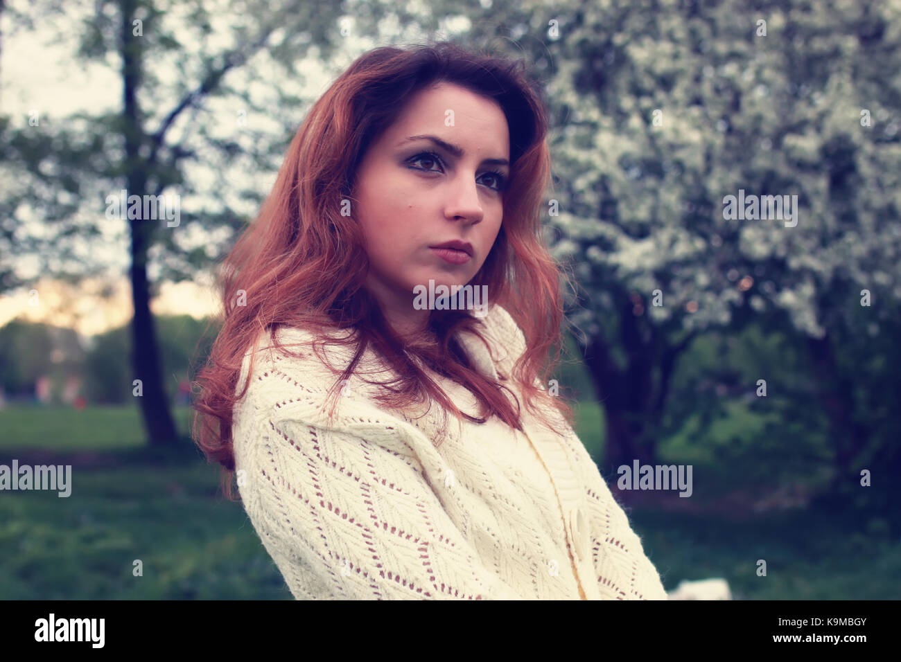 girl walking in spring apple alley Stock Photo - Alamy