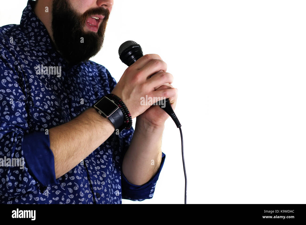 microphone on stage hand hold Stock Photo - Alamy